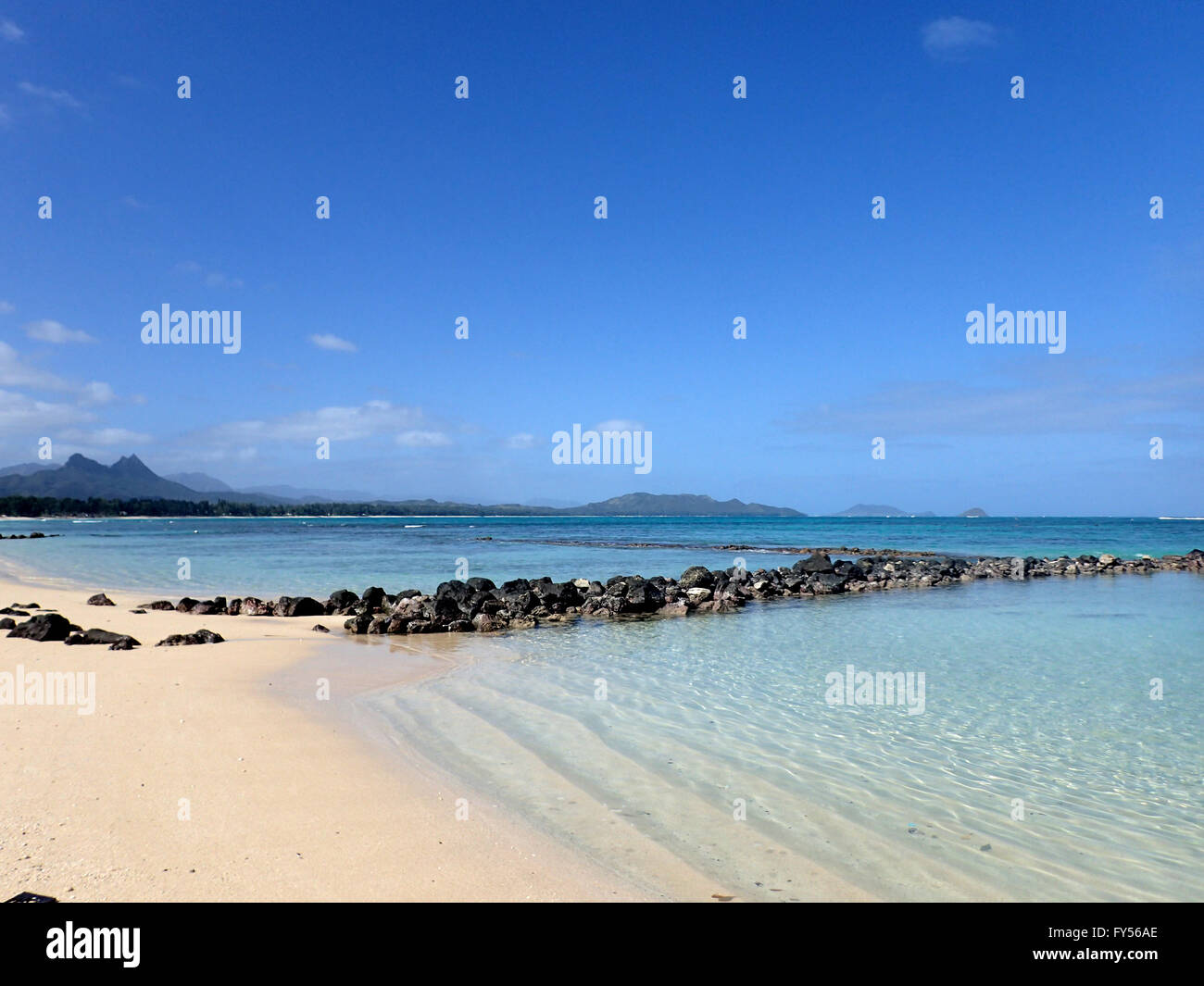 Pahonu Pond (Ancient Hawaiian Fishpond) with Shallow wavy ocean waters ...
