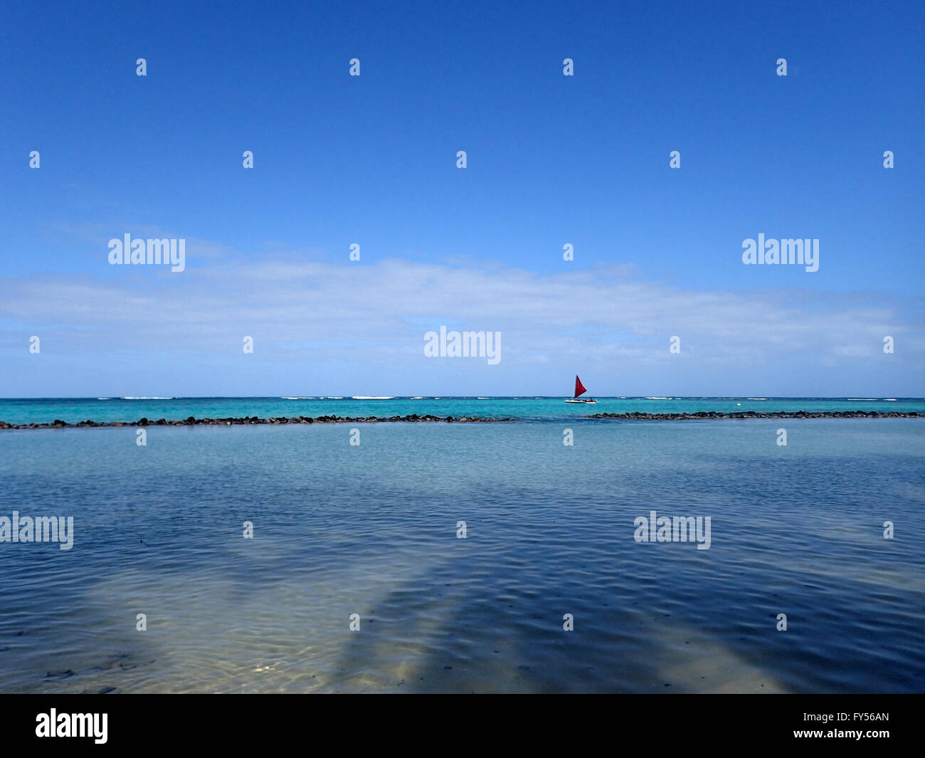 Pahonu Pond (Ancient Hawaiian Fishpond) with Shallow wavy ocean waters ...