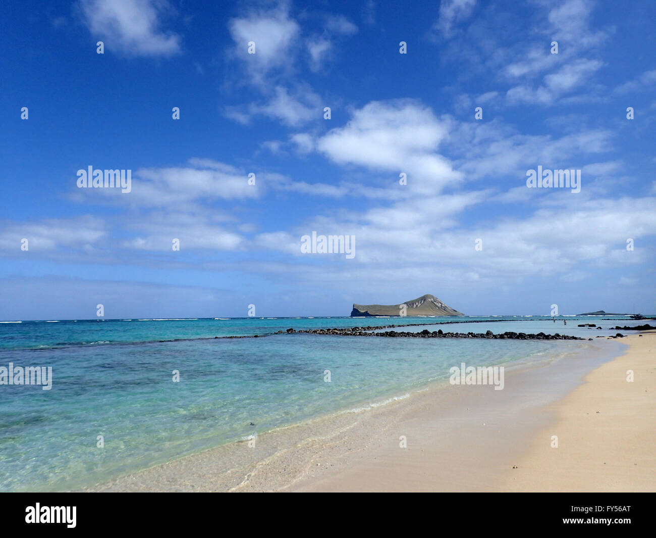 Pahonu Pond (Ancient Hawaiian Fishpond) with Shallow wavy ocean waters ...