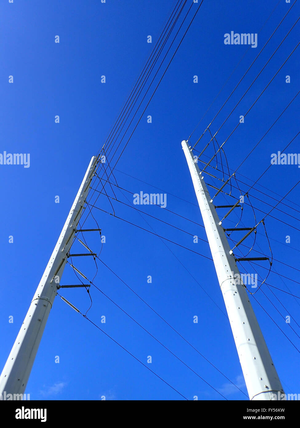 High Voltage Power Lines run through a large metal Utility pole in Oahu ...
