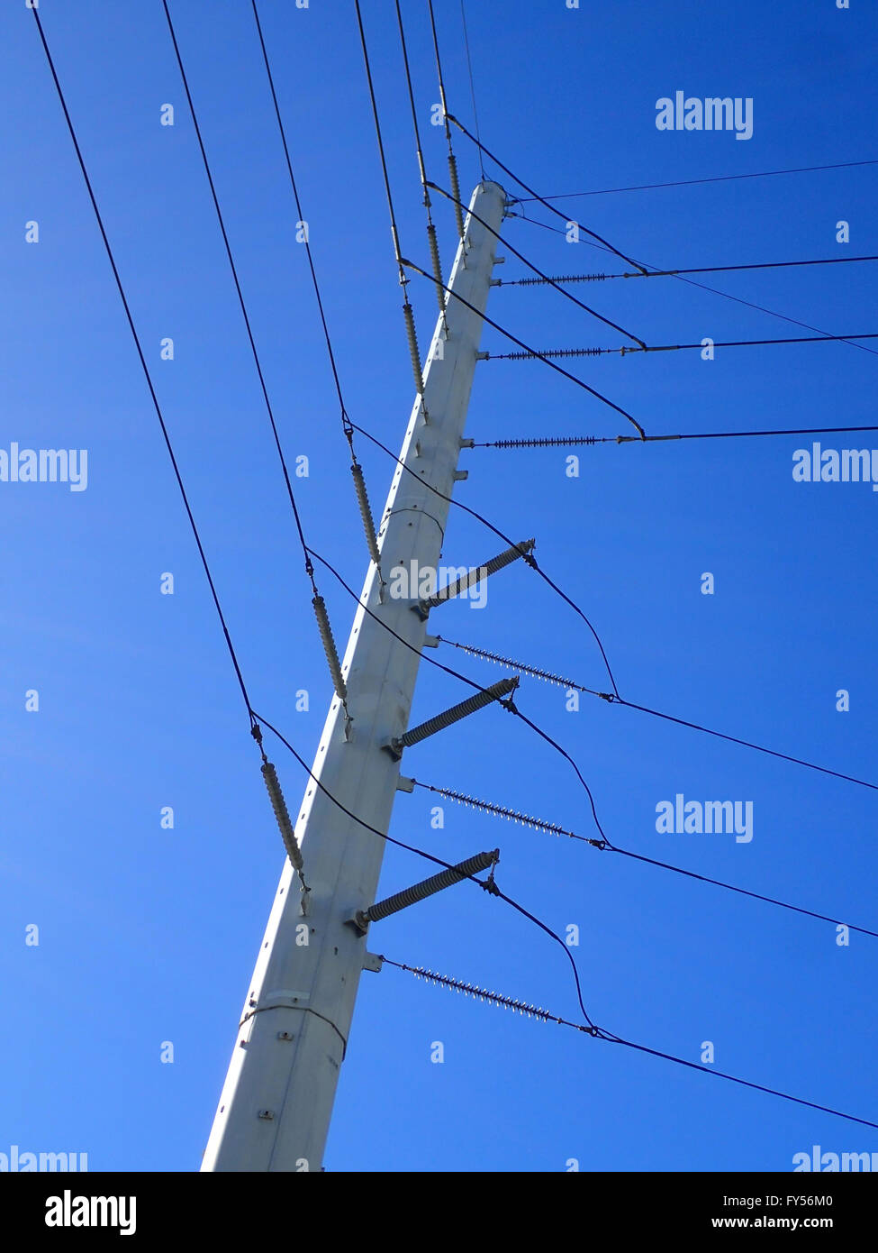 High Voltage Power Lines run through a large metal Utility pole in Oahu ...