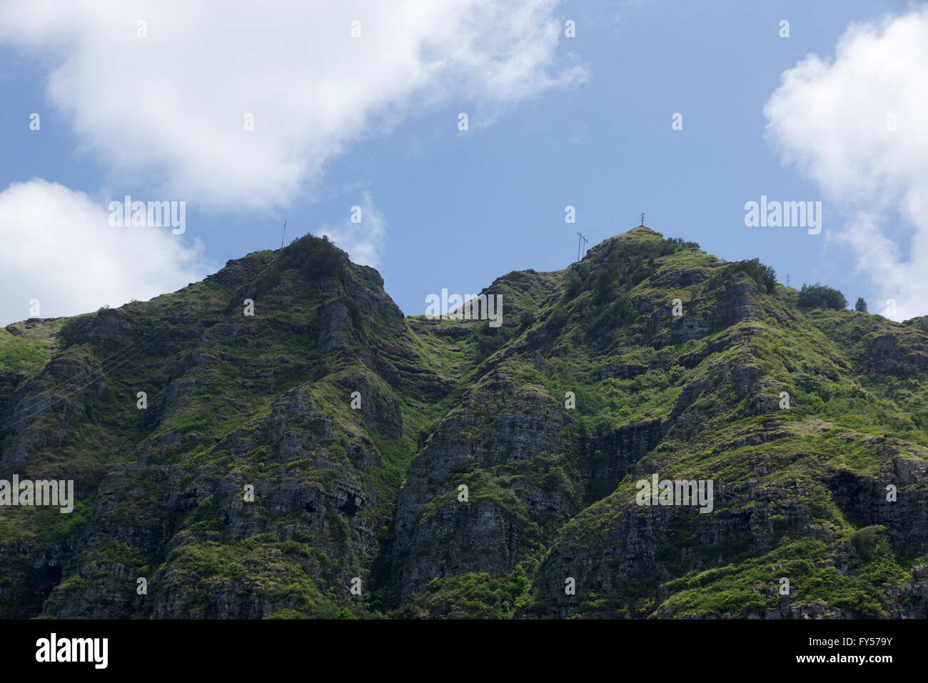 Close-up of top area of Koʻolau Range with powerlines running across it ...