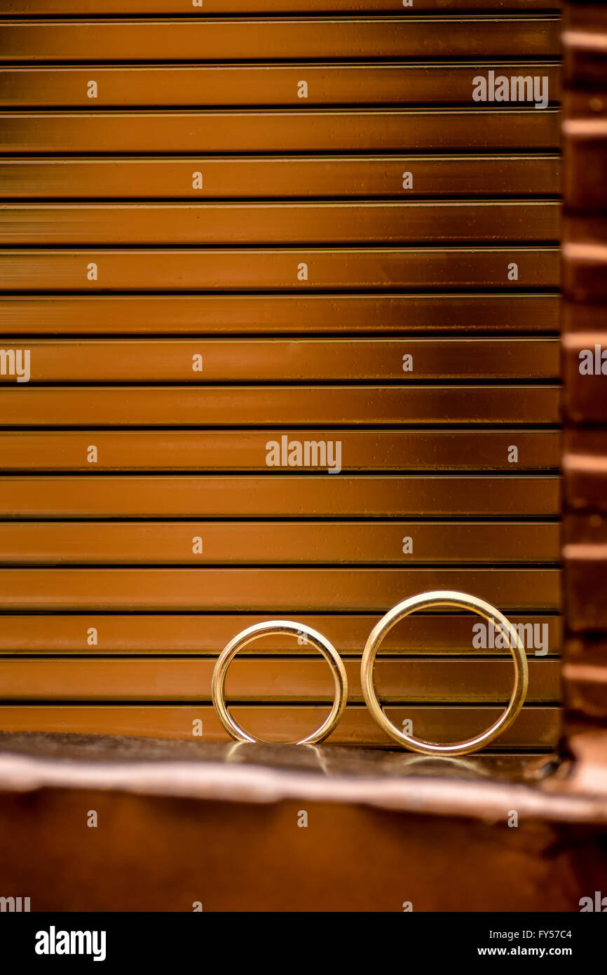 Two wedding ring next to abstract background Stock Photo - Alamy