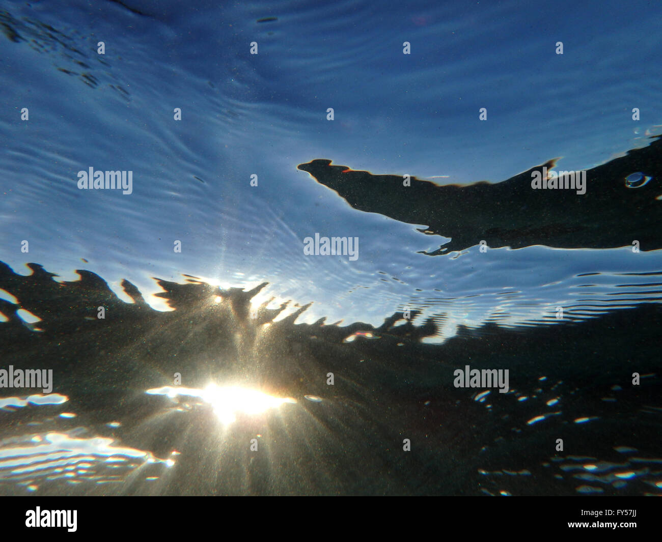Sun light underwater with wave ripples and particles of sand Stock ...