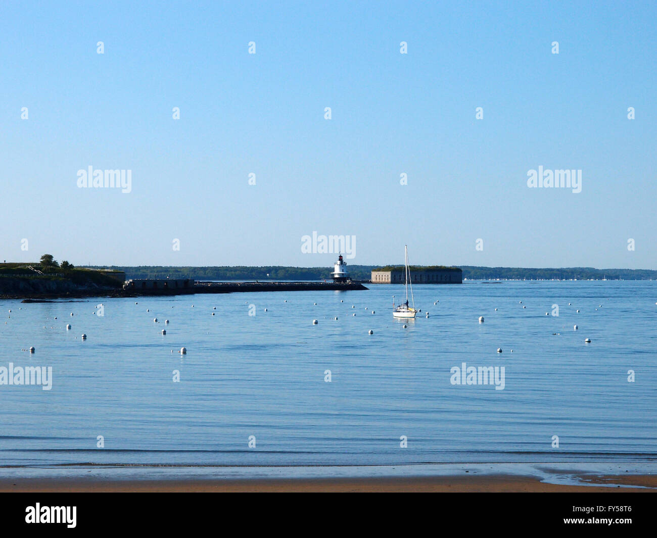 Beach with Portland Breakwater Lighthouse "Bug Light" at end of jetty ...