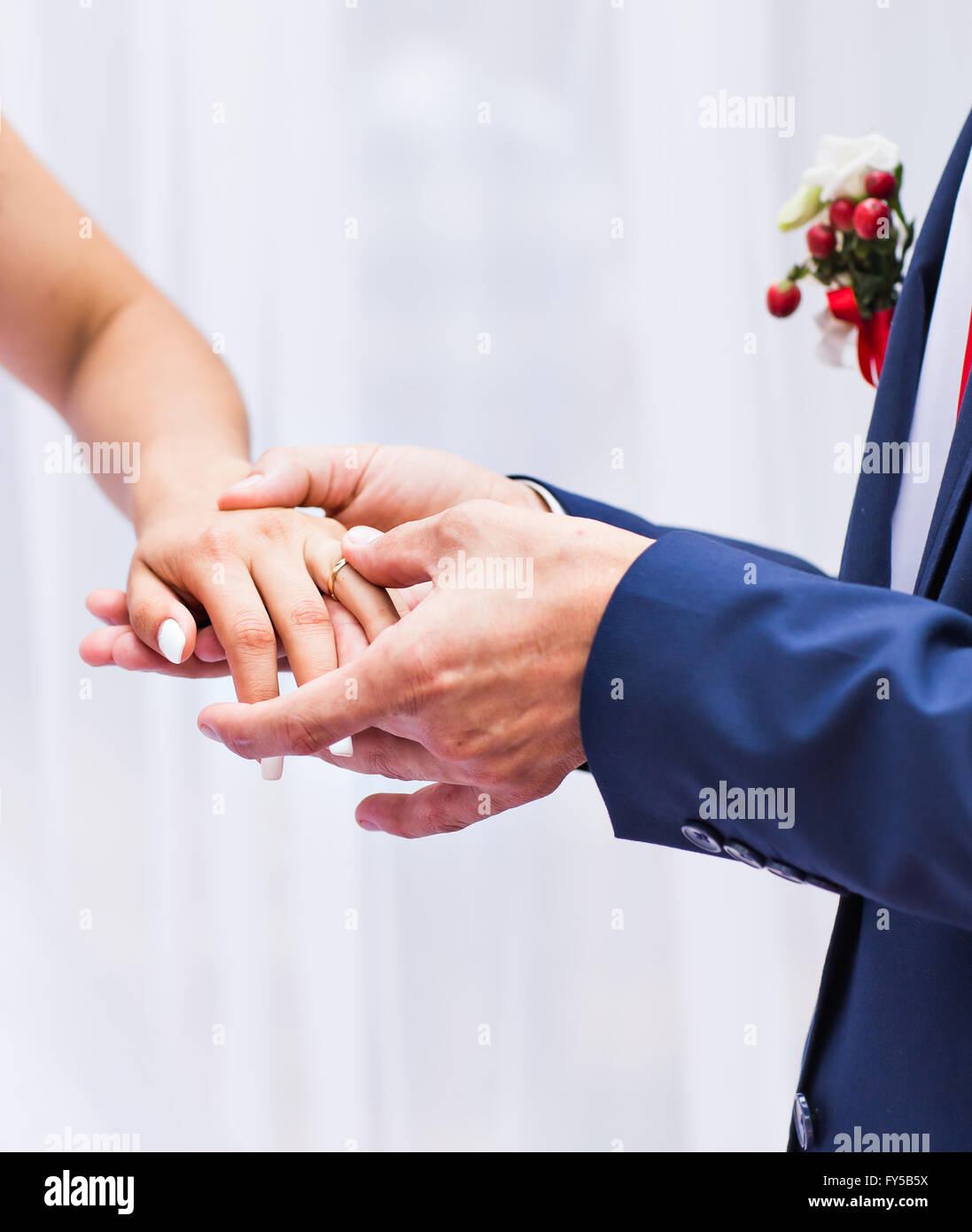 picture of man putting wedding ring on woman hand Stock Photo - Alamy
