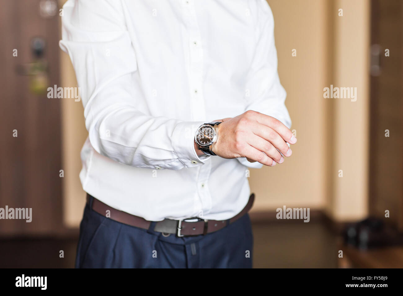 close-up of man puts on a watch Stock Photo - Alamy