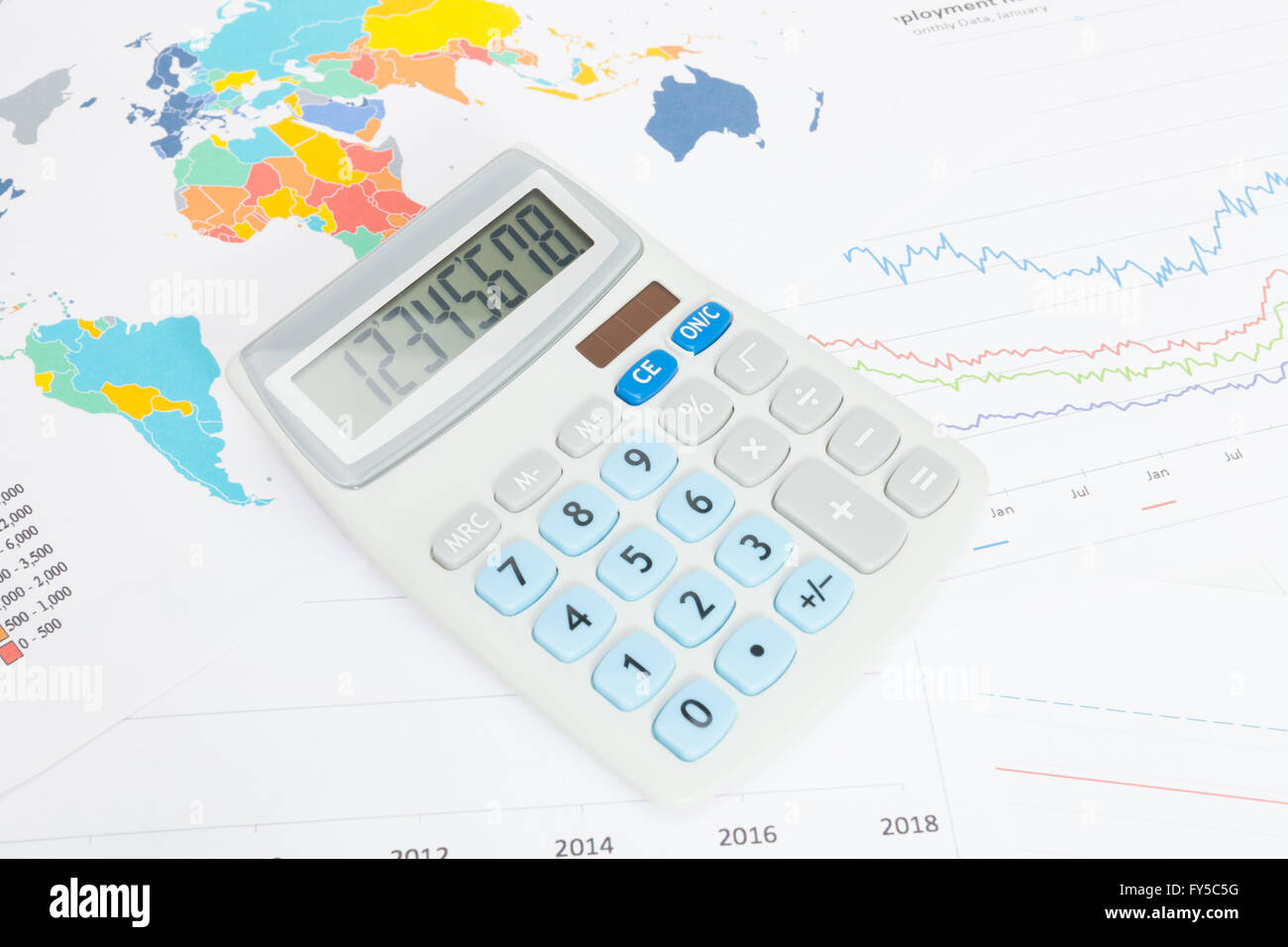 Data charts with calculator over it series Stock Photo - Alamy