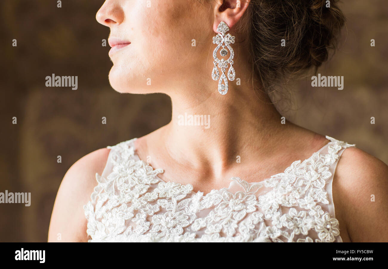 close up of beautiful woman wearing shiny diamond earrings Stock Photo ...