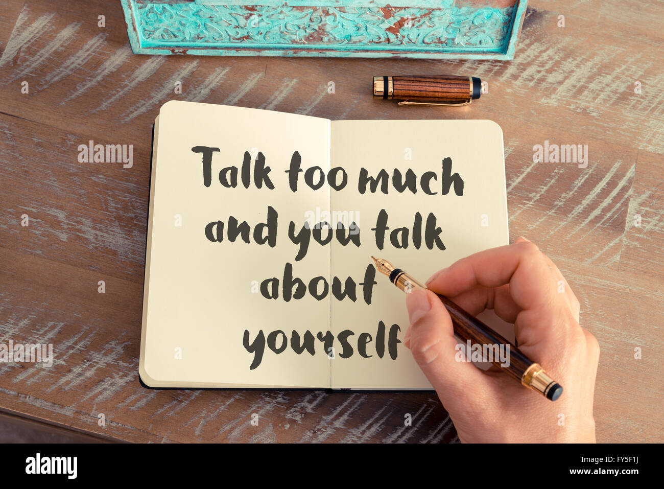 Handwritten quote Talk too much and you talk about yourself Stock Photo ...