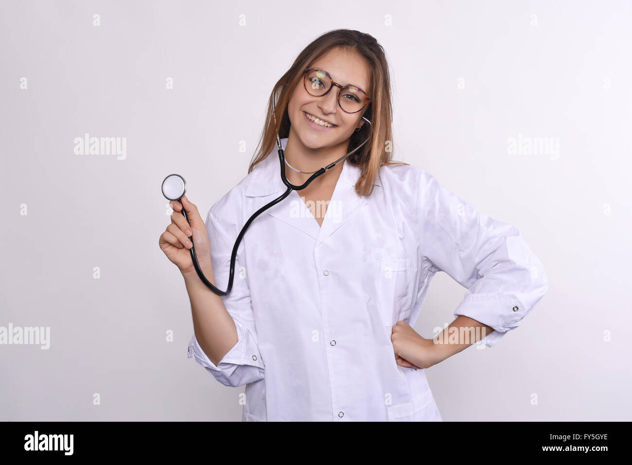 Close up of a beautiful doctor with a stethoscope. Isolated white ...