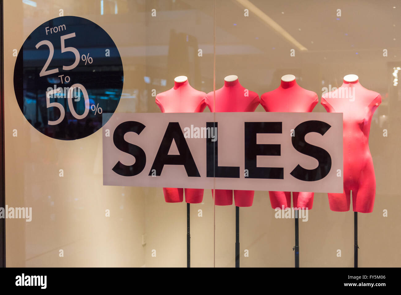 Sale signs with big reductions in shop window Stock Photo - Alamy