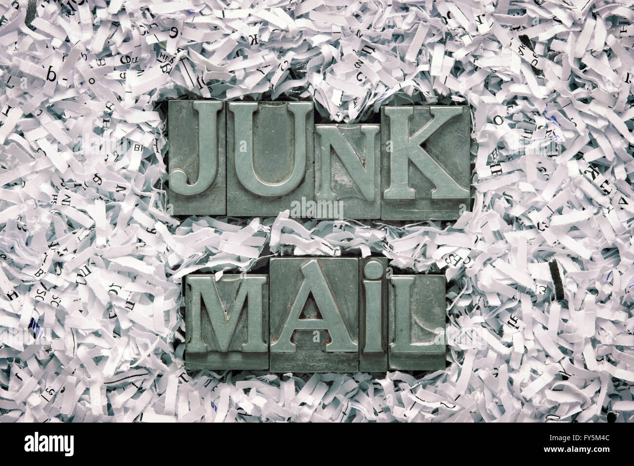junk mail phrase made from metallic letterpress type inside of shredded ...