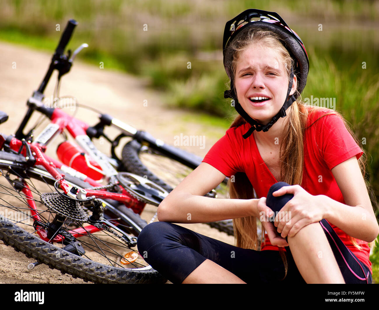 Bikes cycling girl wearing helmet. Girl girl fell off bike Stock Photo ...