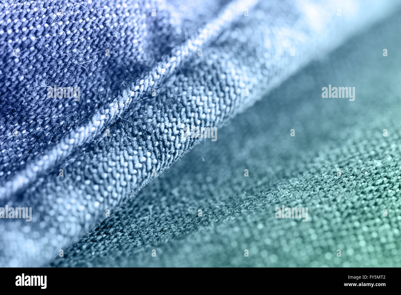 Textile and fabric industry background Stock Photo - Alamy