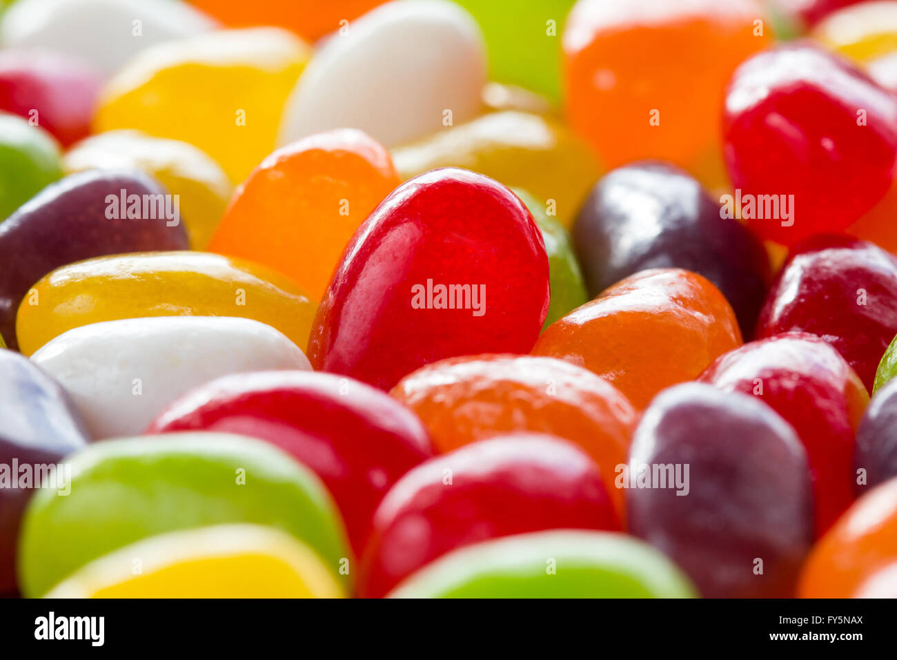 Assorted mix of colorful candies and jellies. Selective focus Stock ...