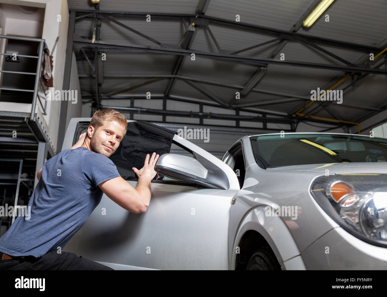 Man tinting a car window hi-res stock photography and images - Alamy