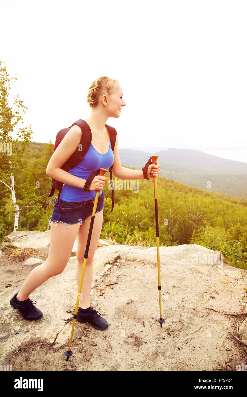 woman with backpack hiking in the mountains Stock Photo - Alamy