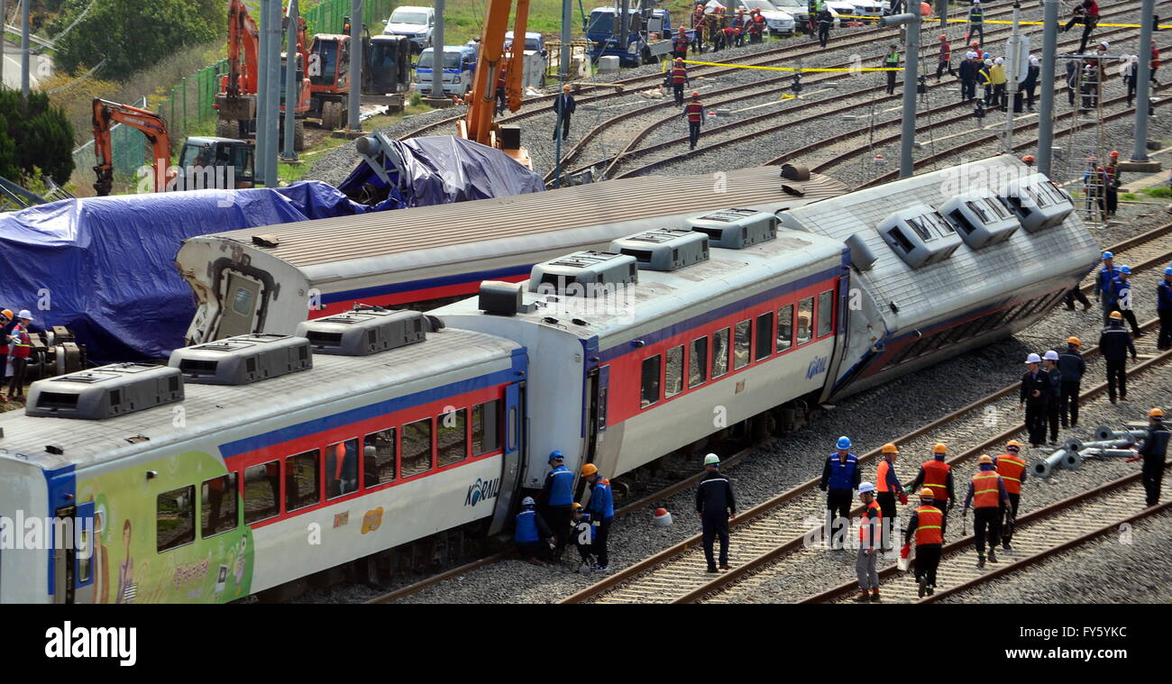 Yeosu, South Korea. 22nd Apr, 2016. Rescuers work at the train ...