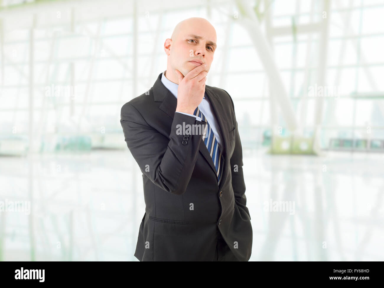 young business man thinking, at the office Stock Photo - Alamy