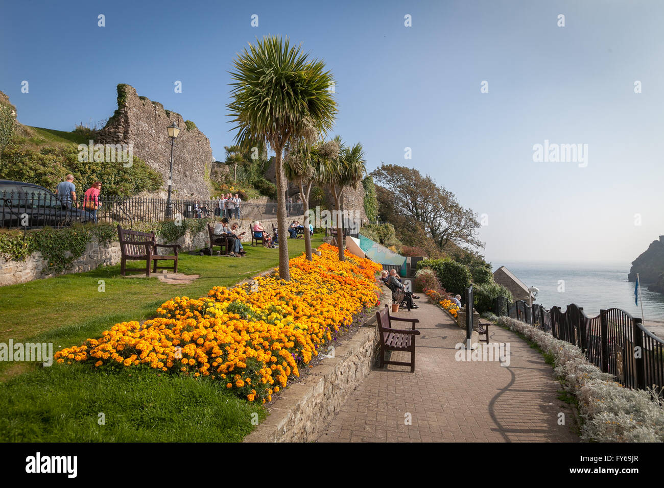 A park and seating area in Tenby, Pembrokeshire with colourful flowers ...
