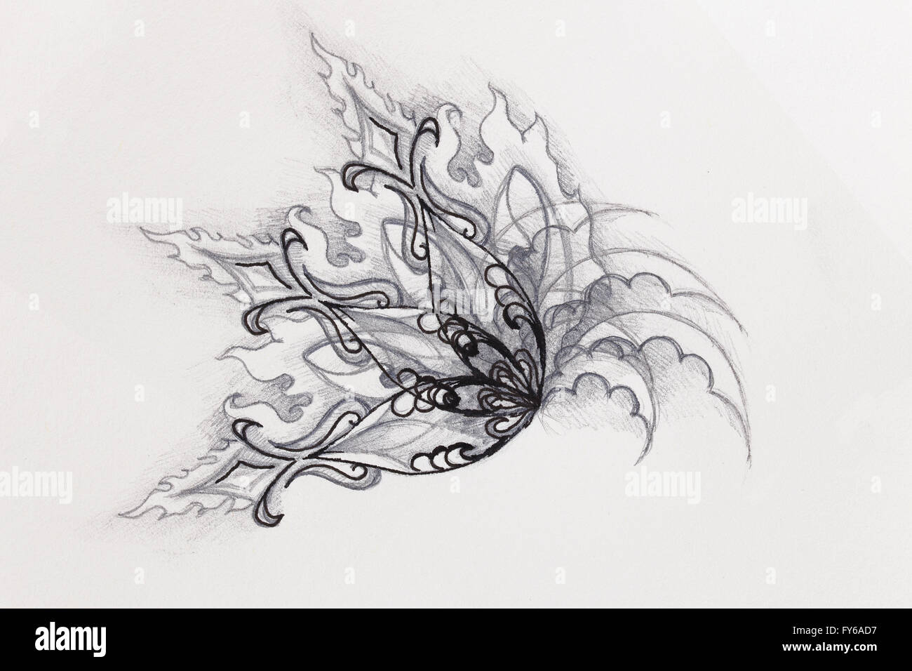 ornamental filigran drawing on paper with flower and flame structure ...