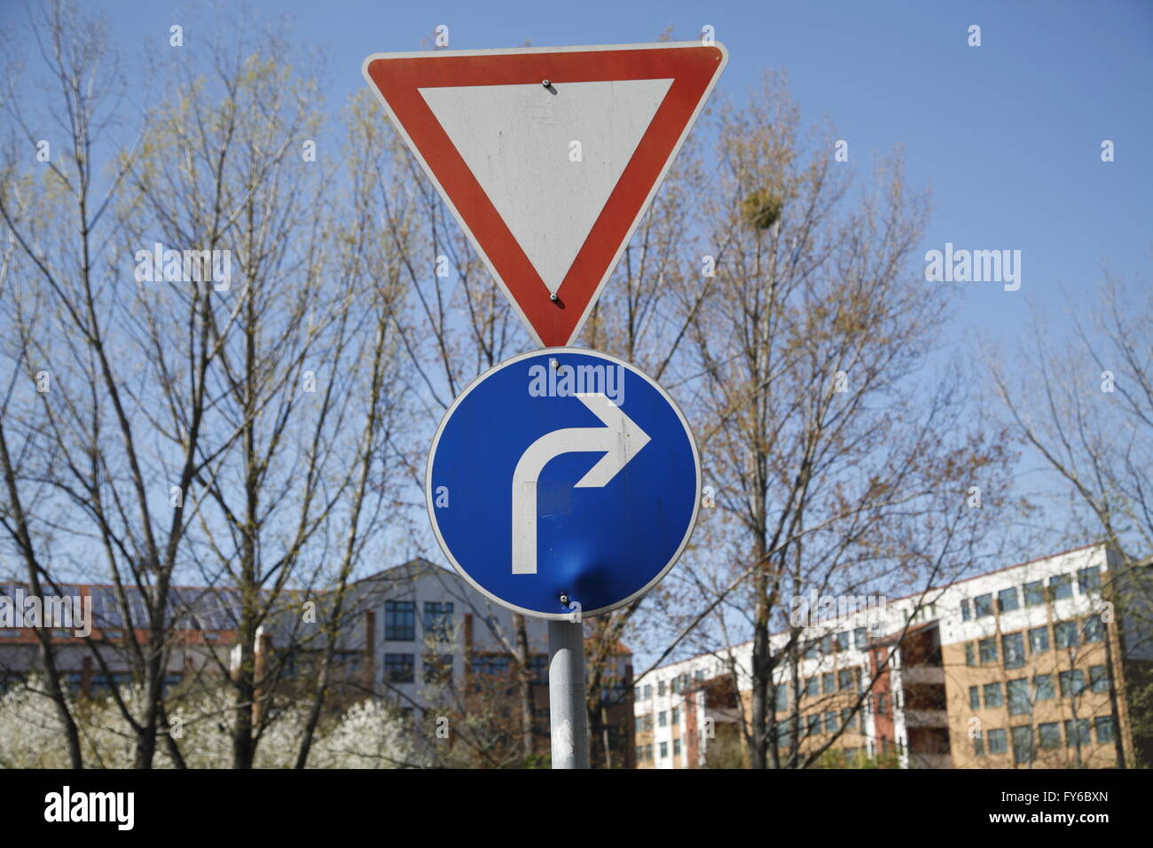 Give way and turn right sign Stock Photo - Alamy