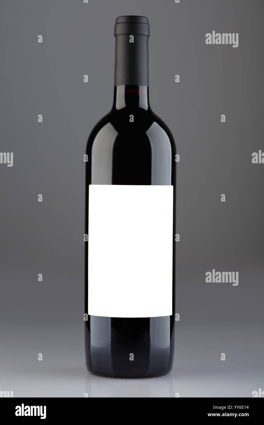 Red wine bottle with blank label on gray background, clipping path ...