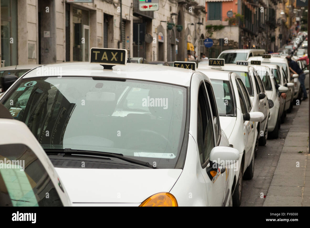 Taxis queuing / queue and wait for passengers at a taxi rank in Naples ...