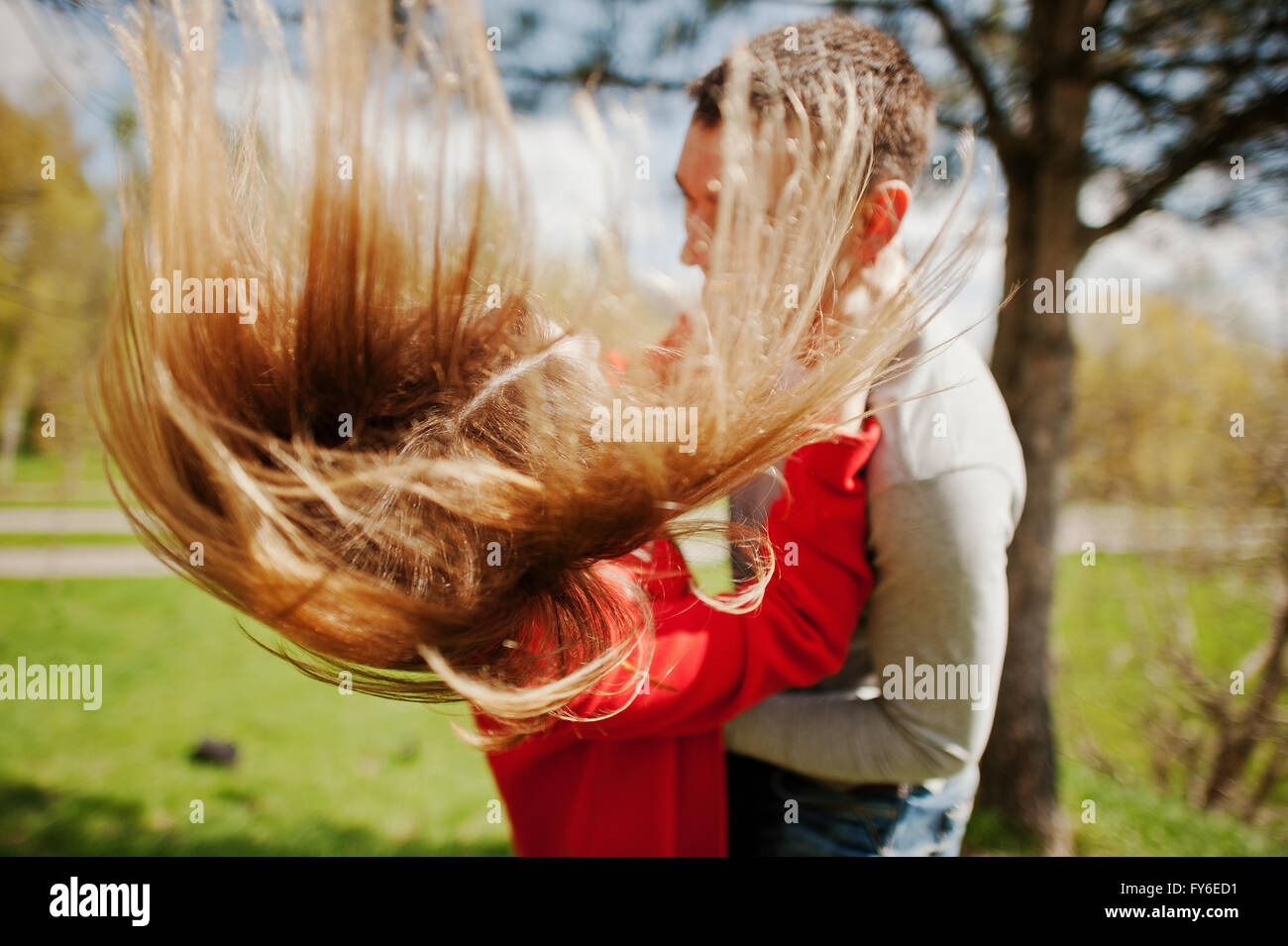 Pretty couple hugging and flirting. Hair in the wind Stock Photo - Alamy