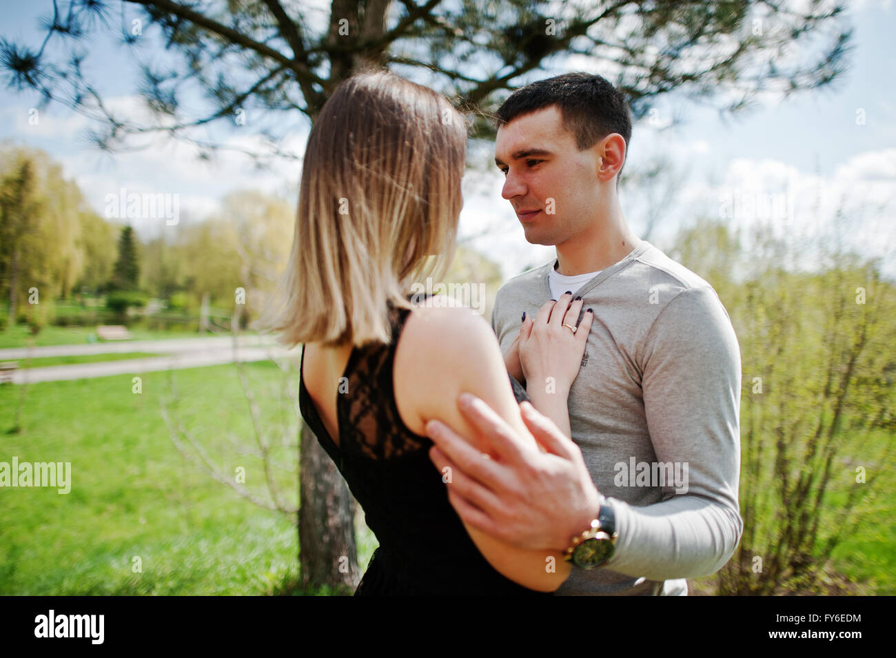 Happy romantic couple in love stay near tree and hugging Stock Photo ...