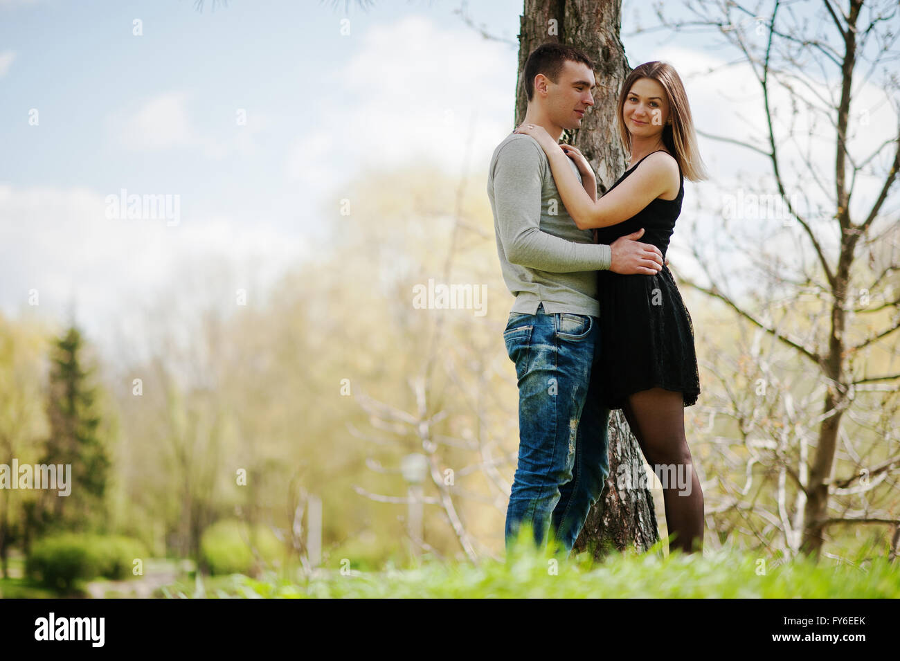 Happy romantic couple in love stay near tree and hugging Stock Photo ...