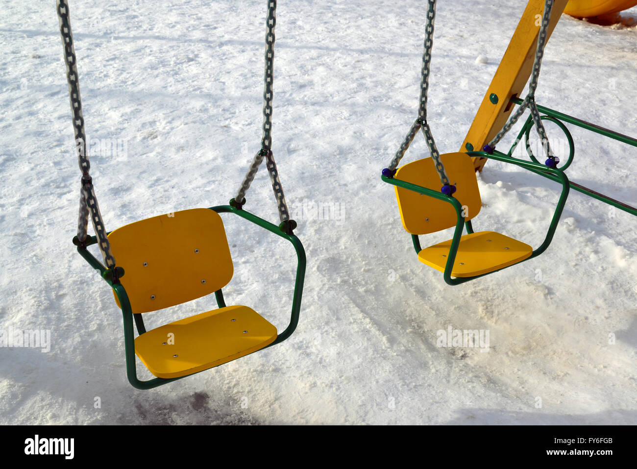 swing at playground in winter Stock Photo - Alamy