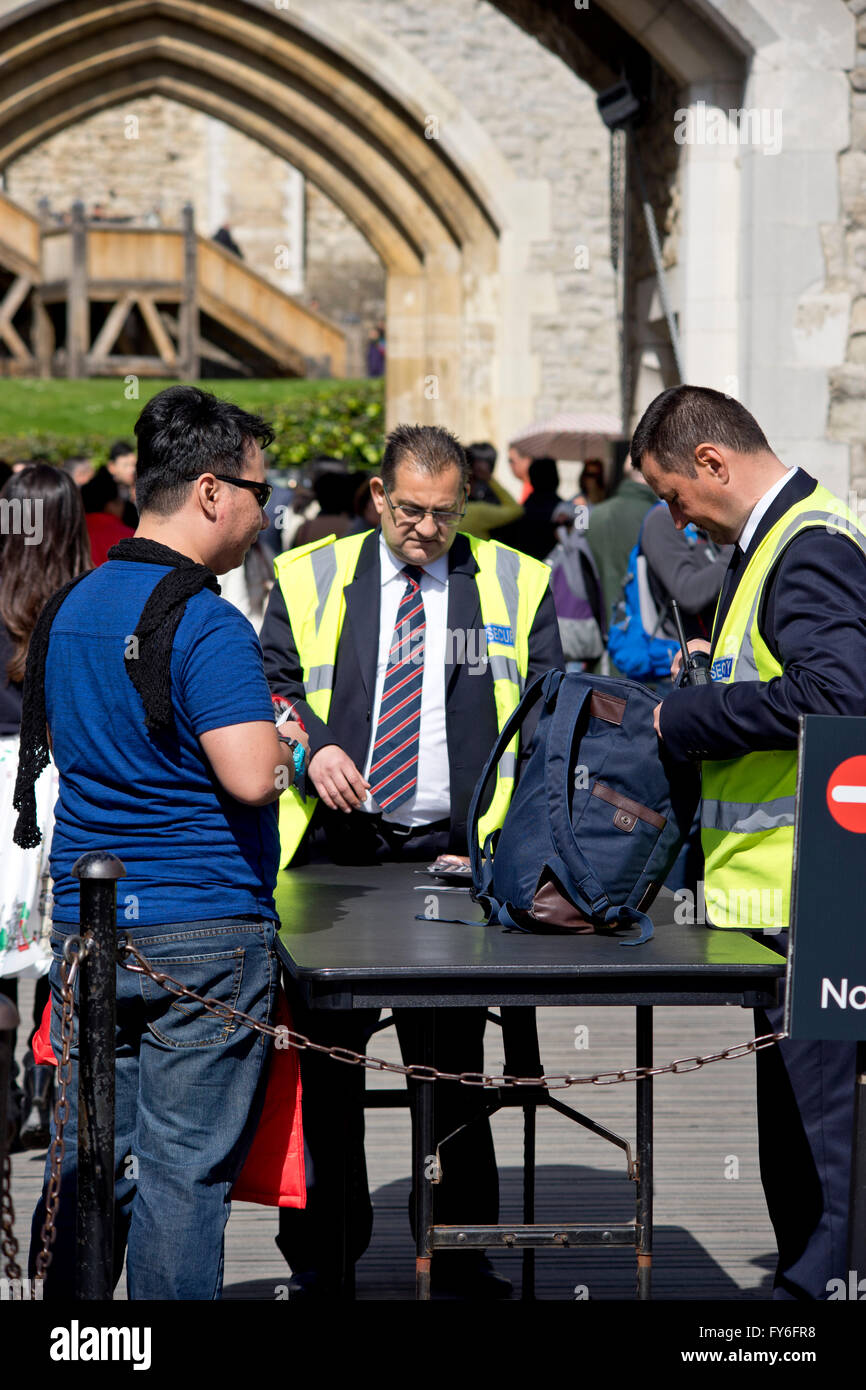 Security guards search tourists at the entrance to the Tower of London ...