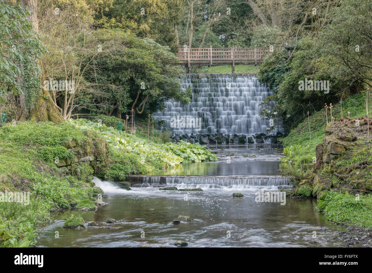 Weir & waterfall with a bridge across the top Stock Photo - Alamy