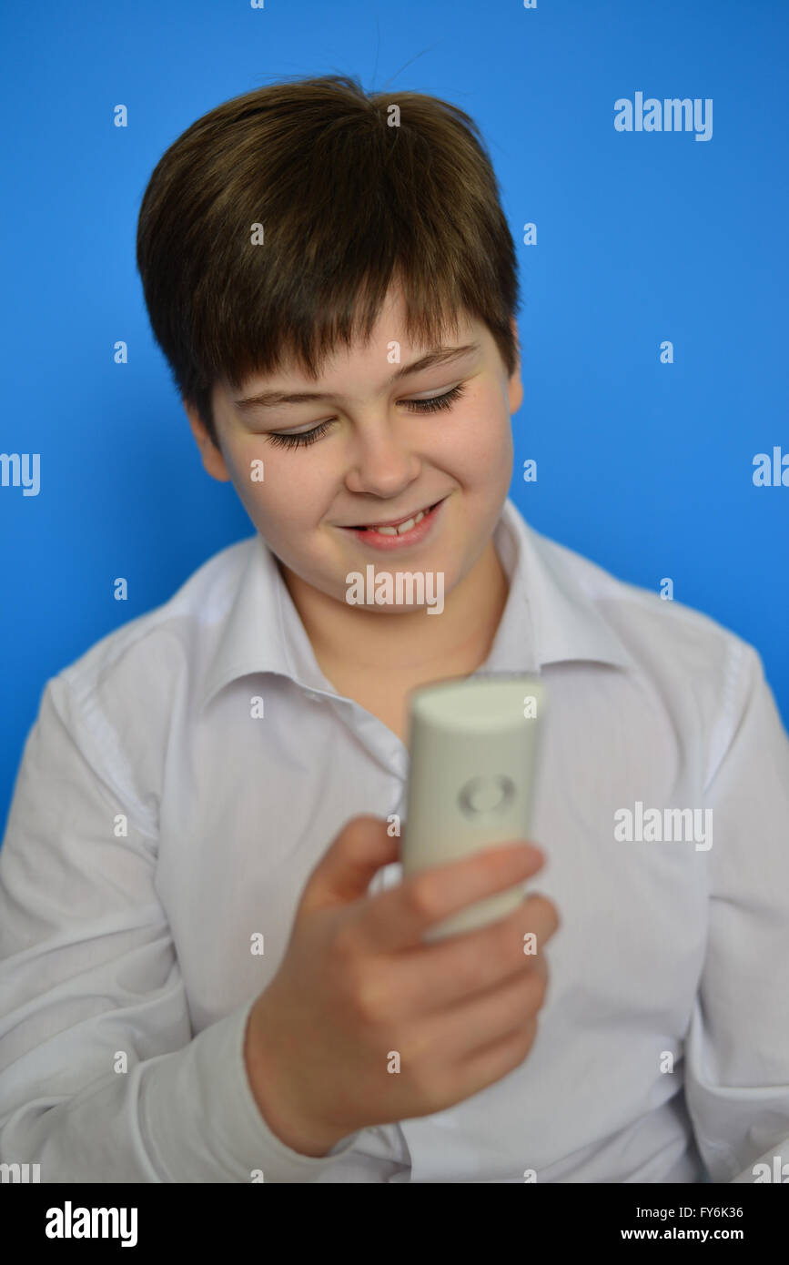 Boy teenager dials the number on radiotelephone Stock Photo - Alamy