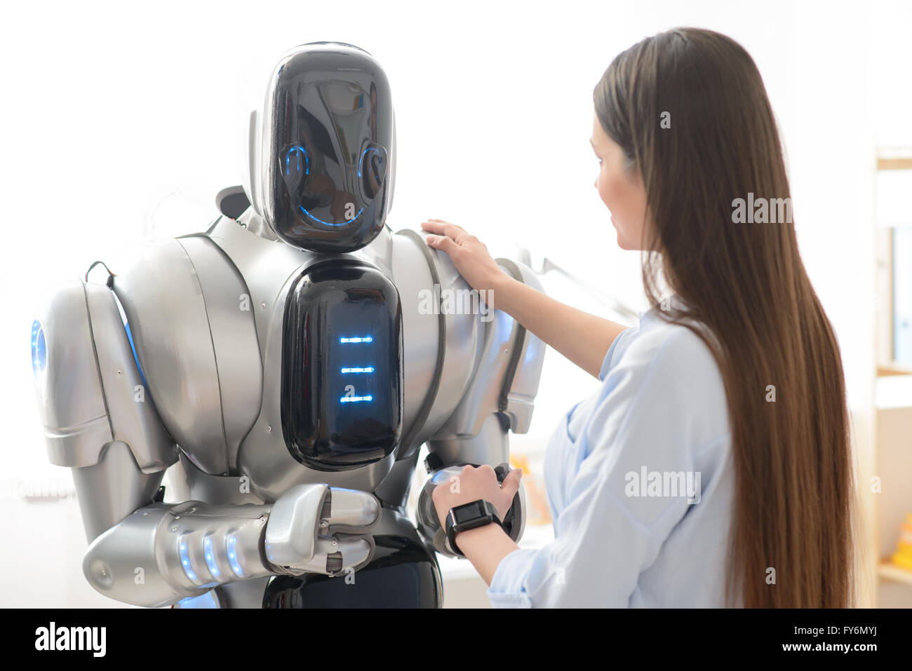 Robot hand holding girl hi-res stock photography and images - Alamy