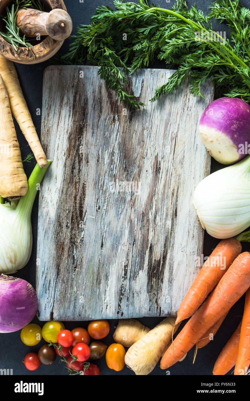 Cooking recipe or menu concept, chopping board with copy space and root ...