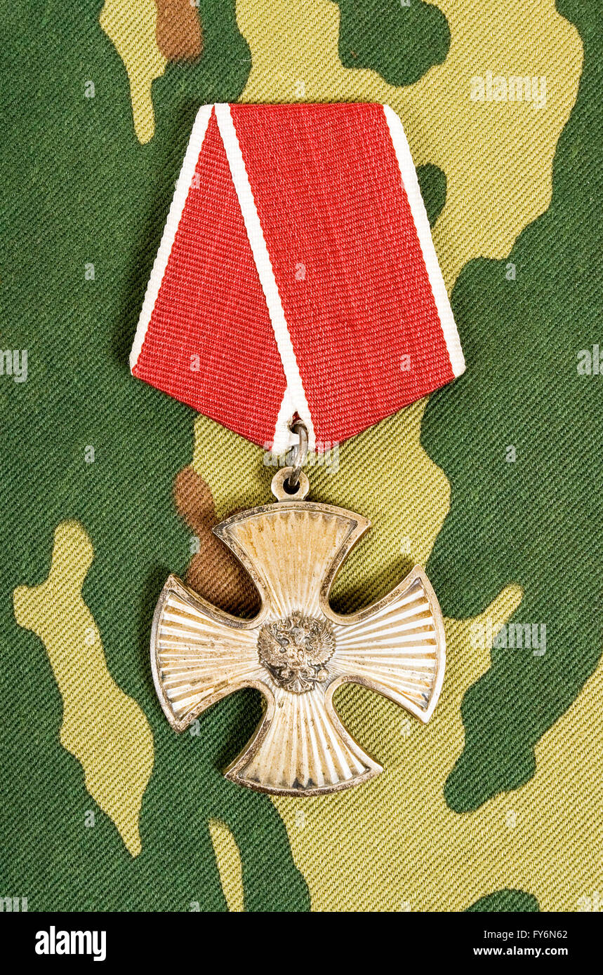Order of bravery on the camouflage background Stock Photo - Alamy