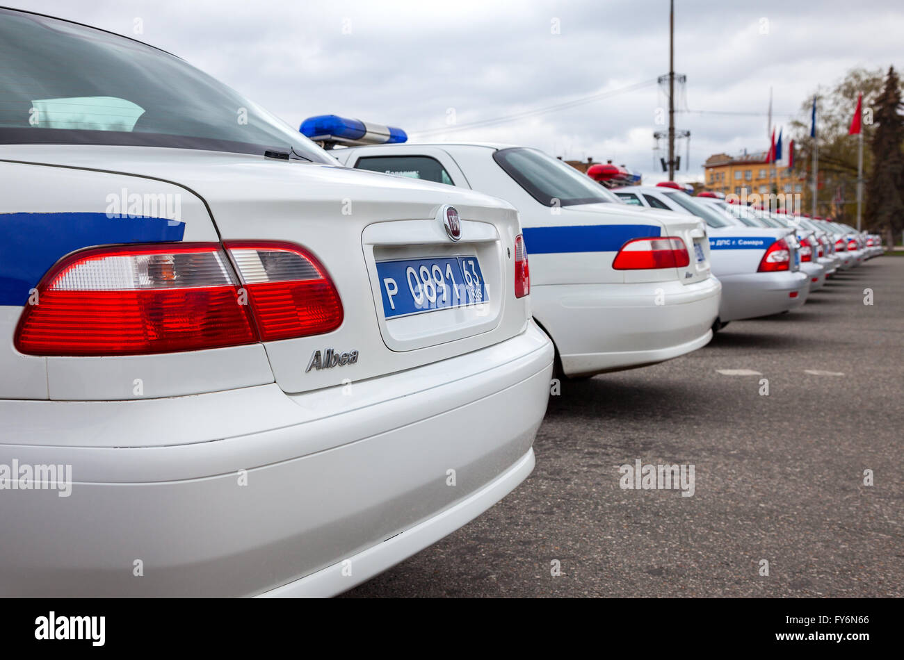 Russian police patrol vehicles parked on the Kuibyshev square in spring ...
