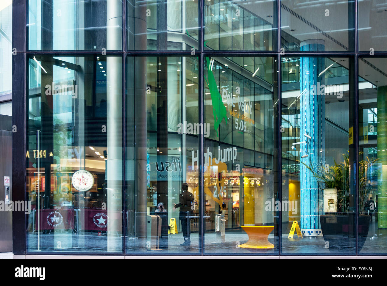 A man in a huge modern office and commerce block in London viewed ...