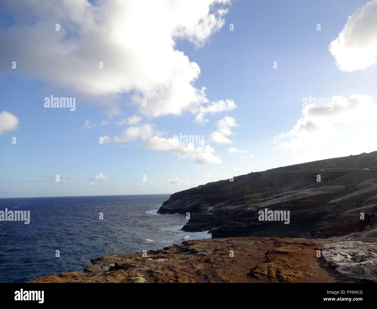 Rugged Southeast lava rock corner cliff shoreline of Oahu with road ...