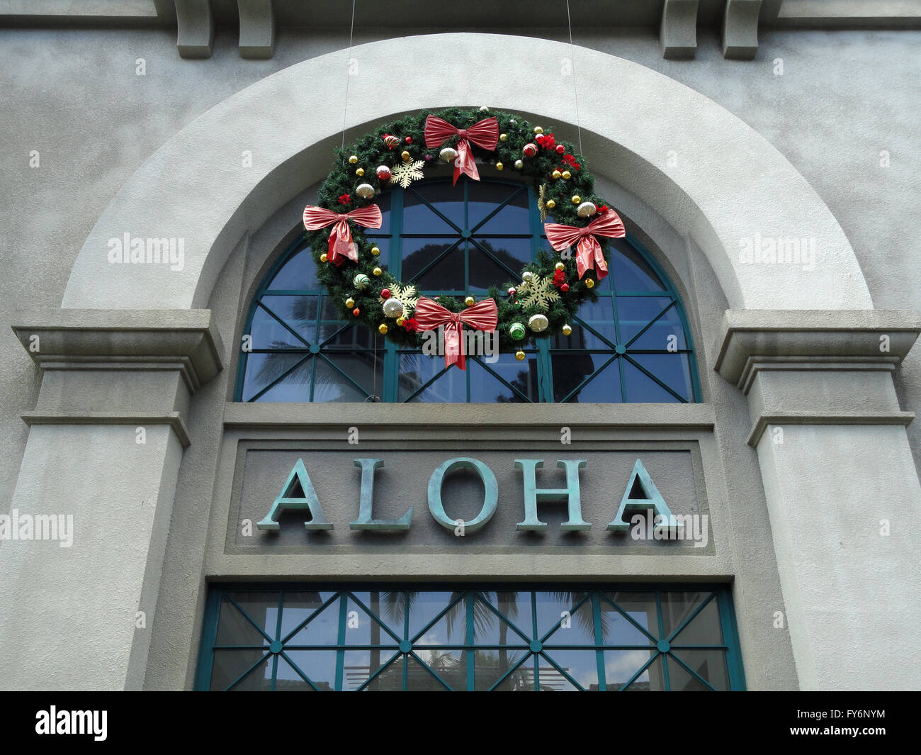 The Word Aloha and Christmas Wreath on side of Aloha Tower building ...