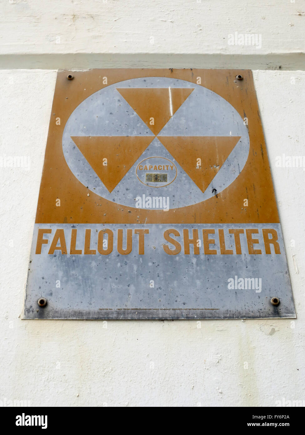 Old Fallout Shelter Sign from the cold war era slowly rusts as it hangs ...