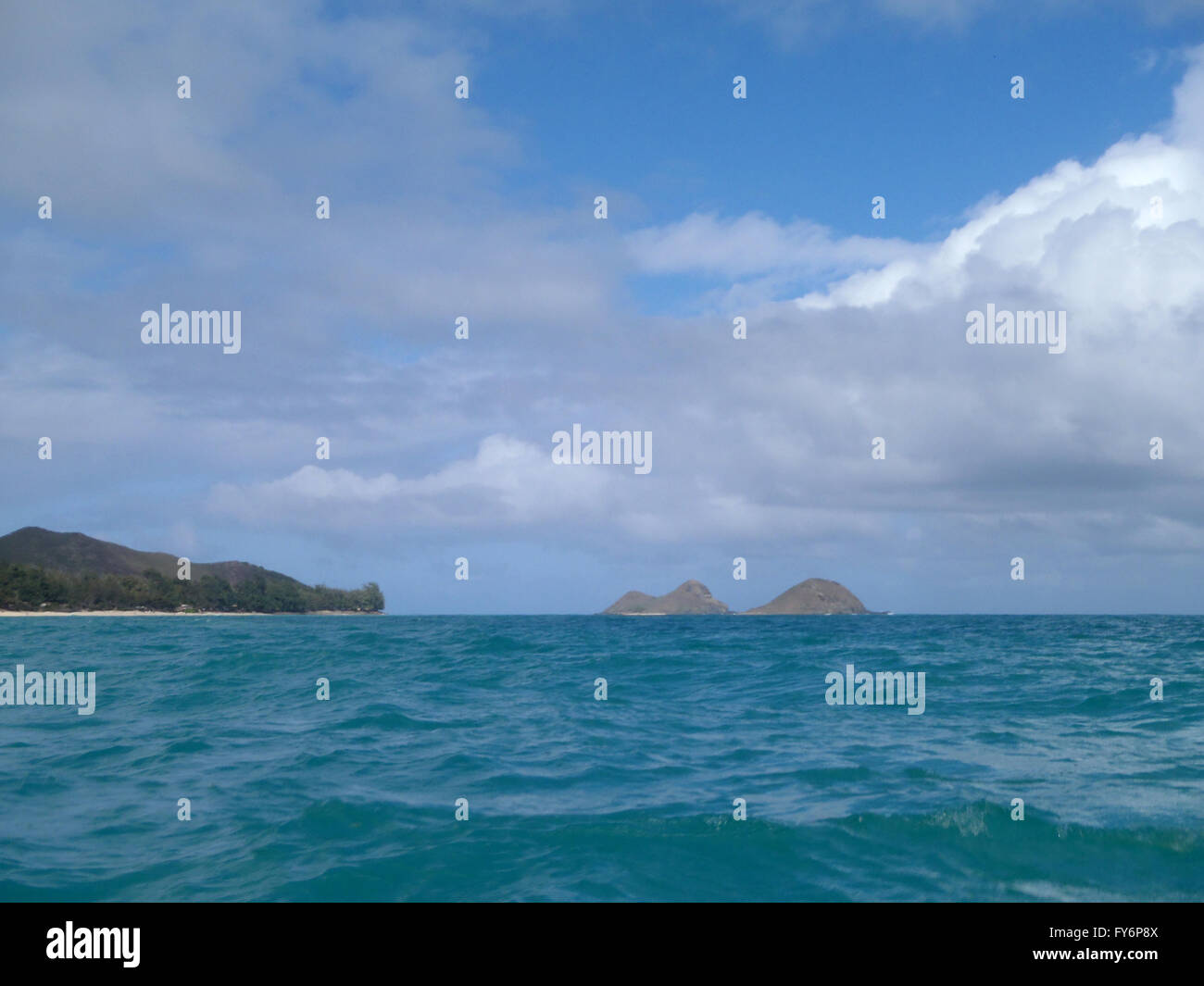 Bellows Beach and Na Mokulua Islands seen from the waters of Waimanalo ...