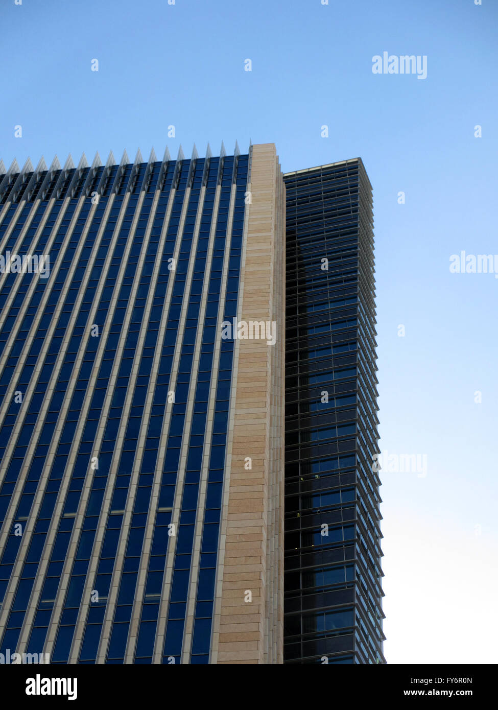 Side Angle of Modern Tall Building with a blue sky Stock Photo - Alamy