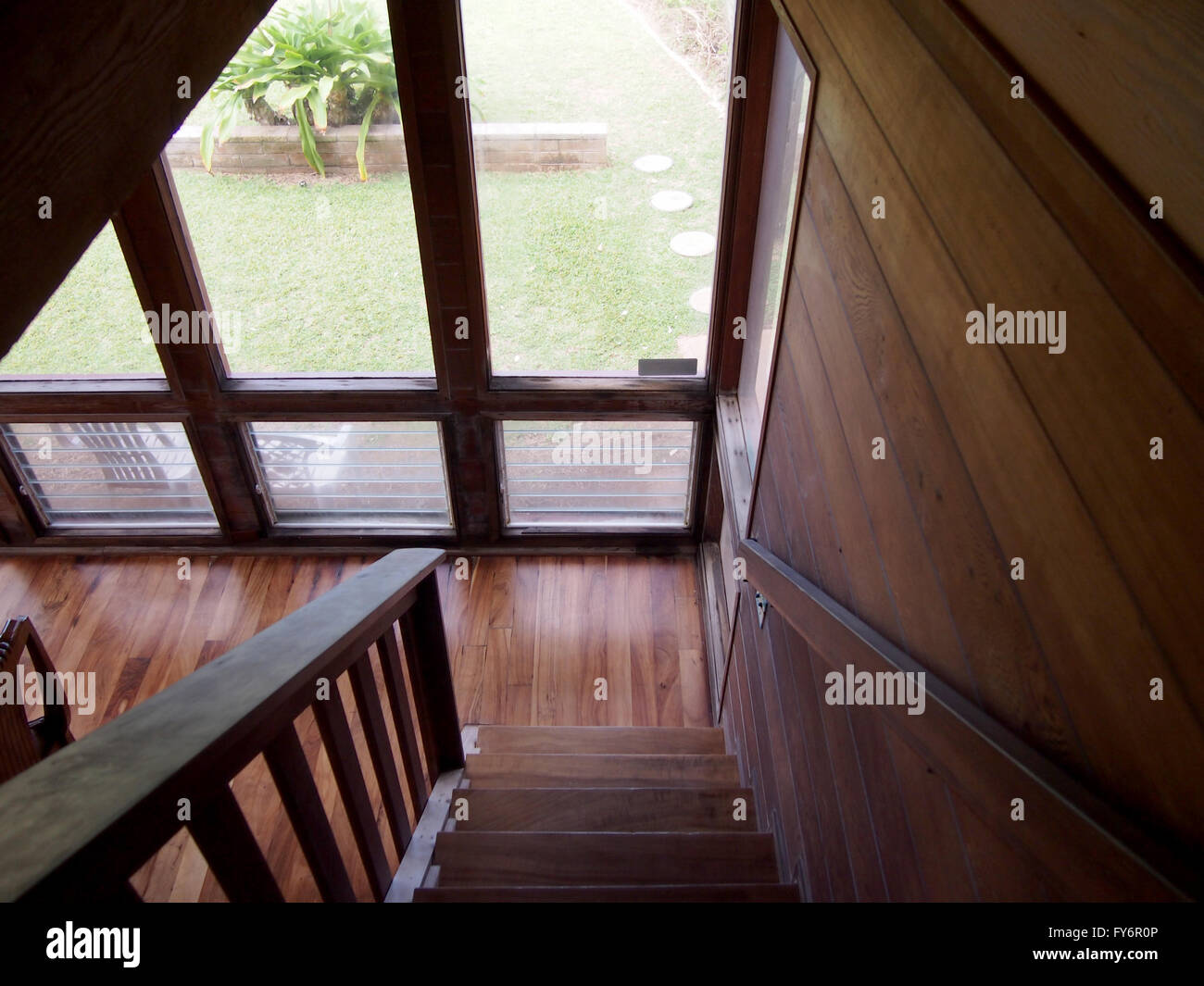 Wood Staircase leading downstairs to the dinning room with large ...