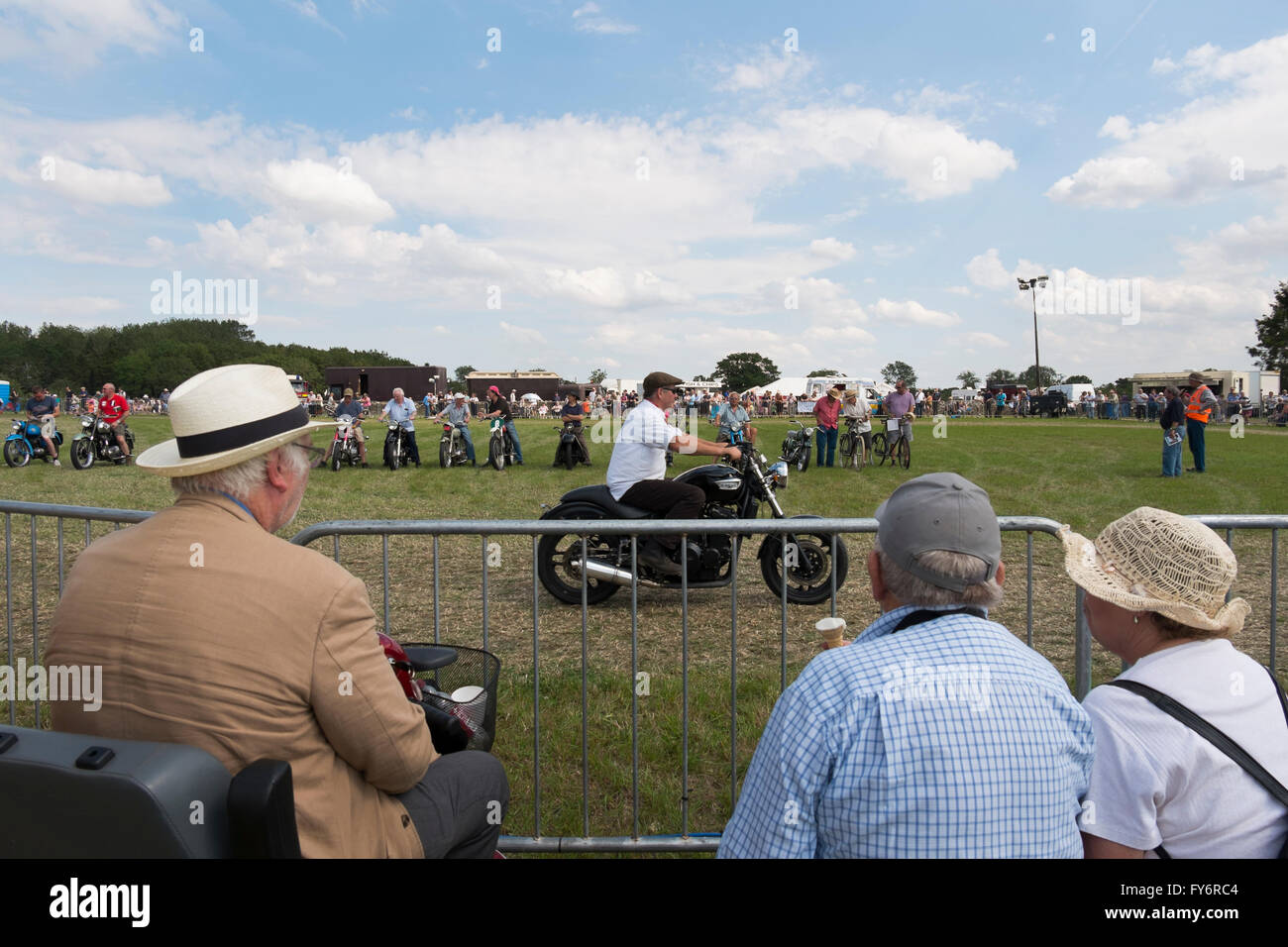 Spectators sitting around the show ring at the Fairford Steam Rally ...
