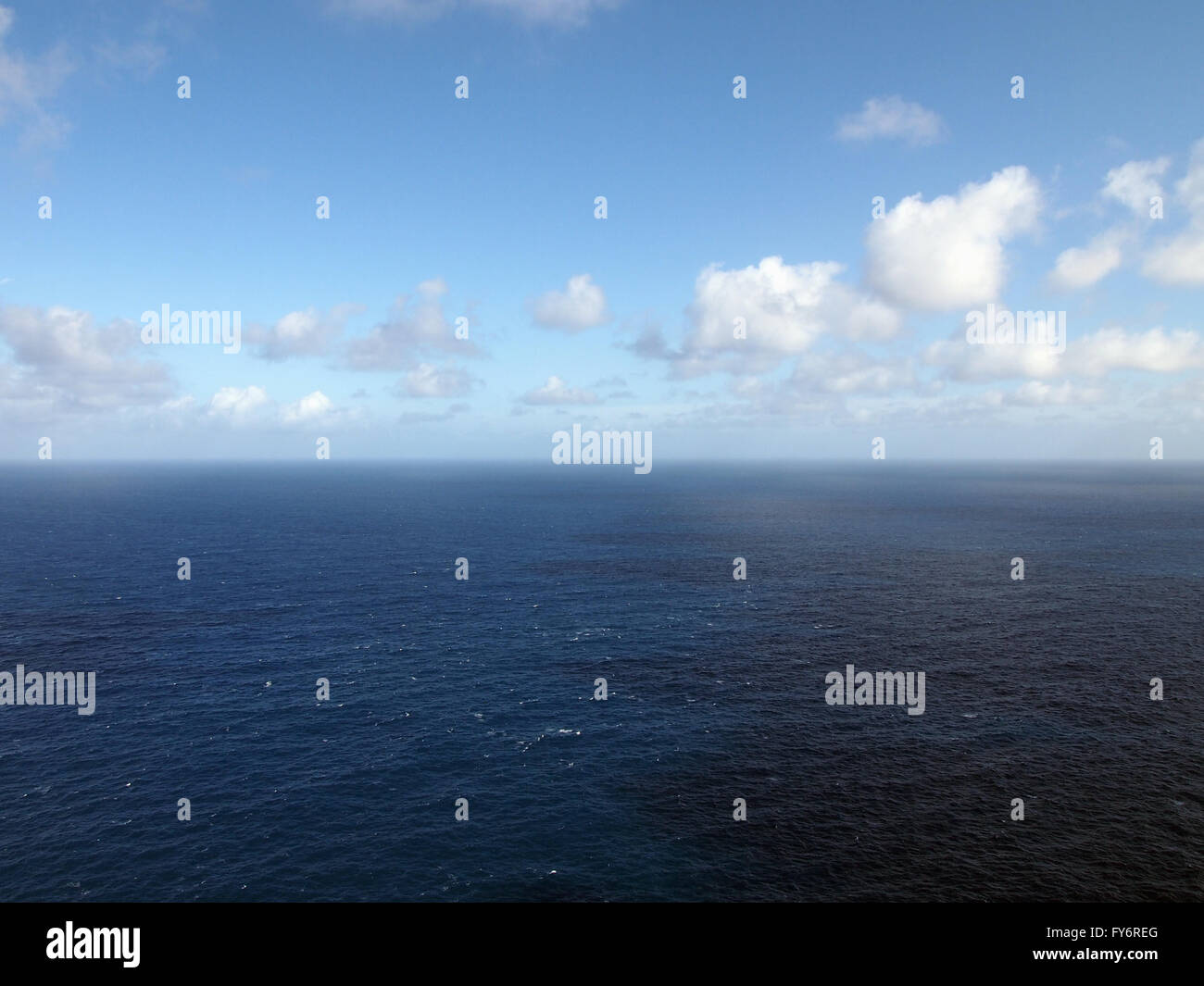 Ocean and Cloud scape with a jagged shadow on the water in the Pacific ...