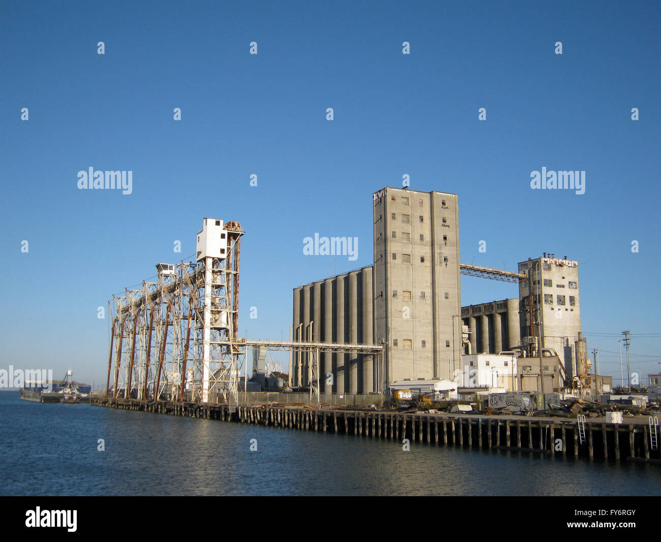 Large old rundown cement factory along the water in San Francisco ...